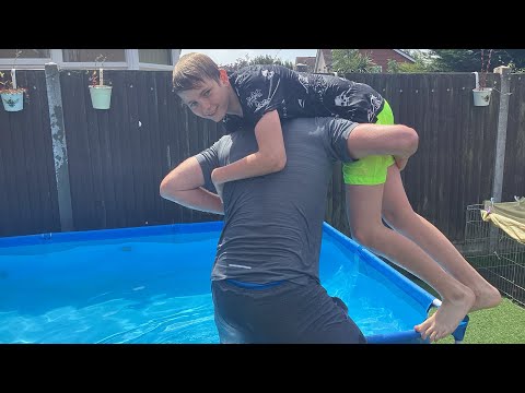 Dad vs son freezing cold swimming pool wrestling match