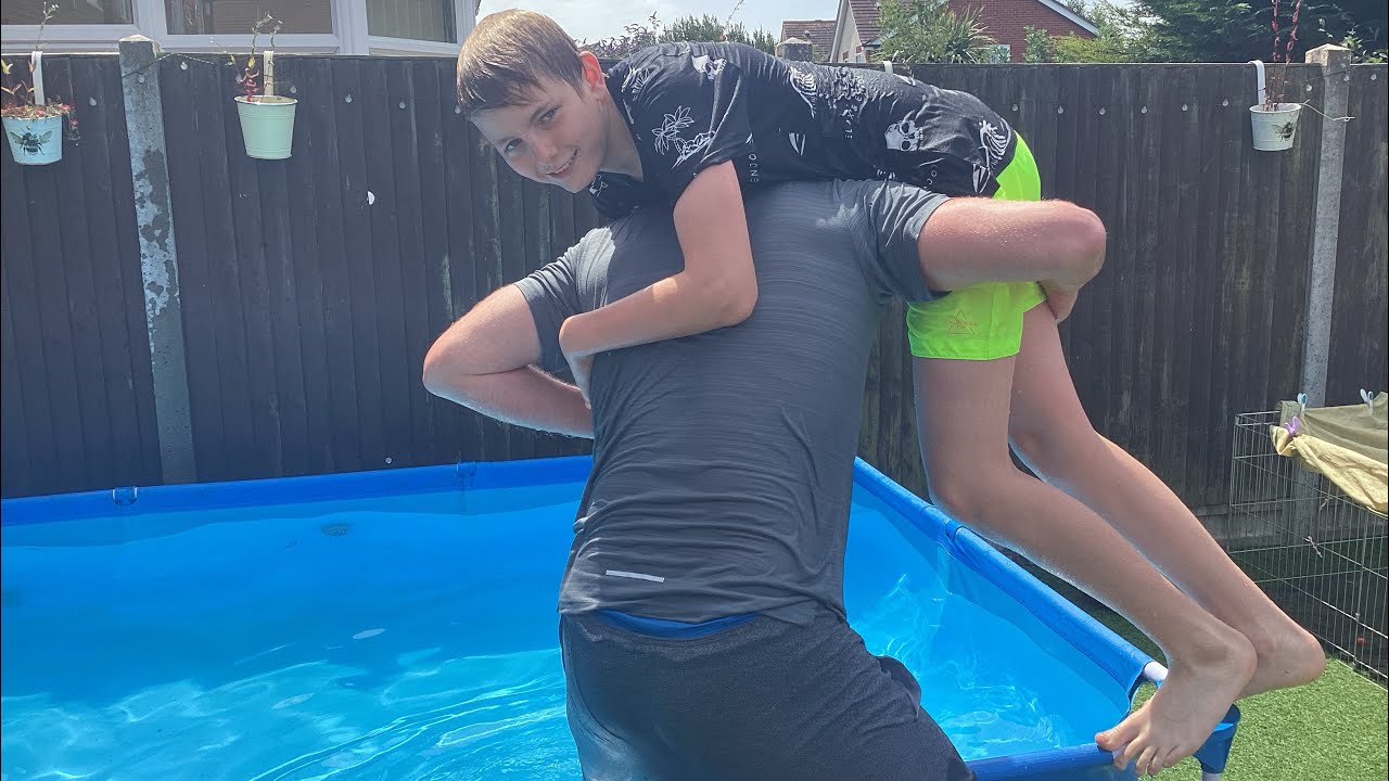 Dad vs son freezing cold swimming pool wrestling match - YouTube