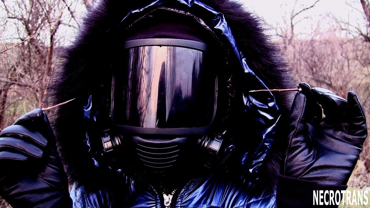 A creature in a spacesuit. Walking in ski suits - shiny snow suit and ...