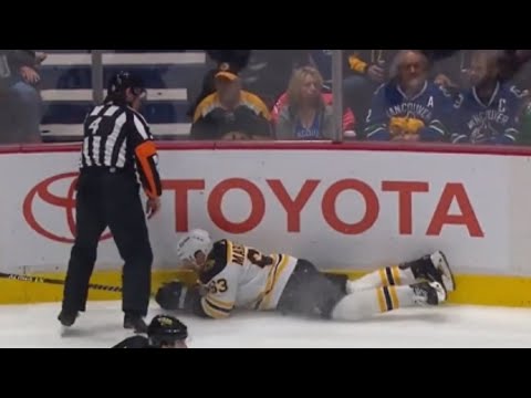 WATCH: Brad Marchand gets DEMOLISHED by NHL referee Wes McCauley ...