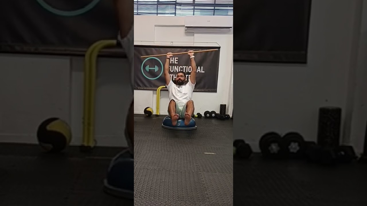 Russian twist on #bosu with overhead press (stick) - YouTube
