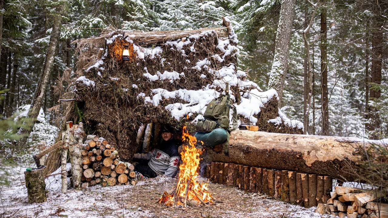 Winter BUSHCRAFT. Building a survival shelter in a cold forest ...