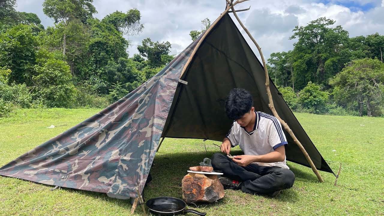 Bushcarft camping on the beautiful grass on the lakeshore - canvas tent ...