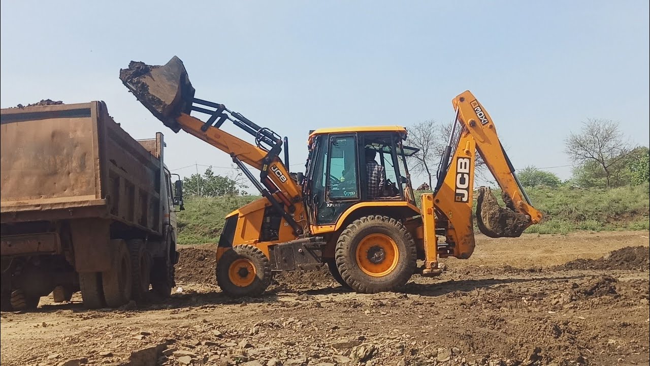jcb 3dx bakhoe loder loding mud in forming land in village/ jcb and Tata 2518 hyva making pond ...