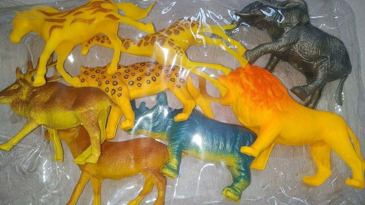 Unboxing of zoo animals toys lion tiger elephant horse giraffe cow ...