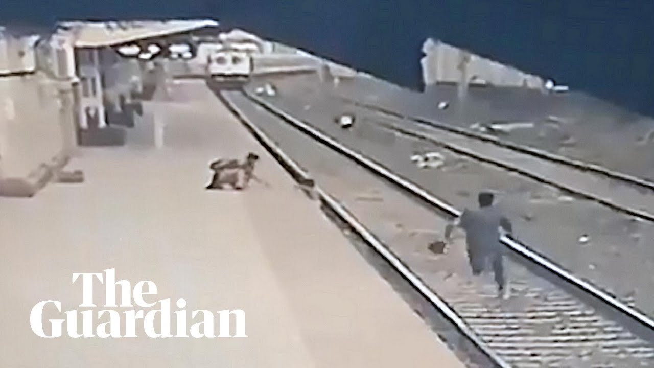 Railway worker saves boy from being run over by train - YouTube