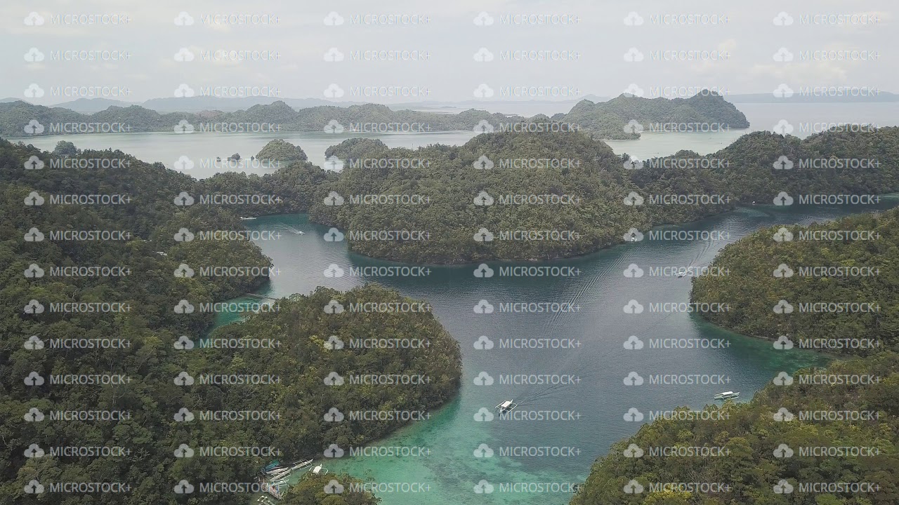 Amazing aerial view of green lagoon and rainforest hills in the ...