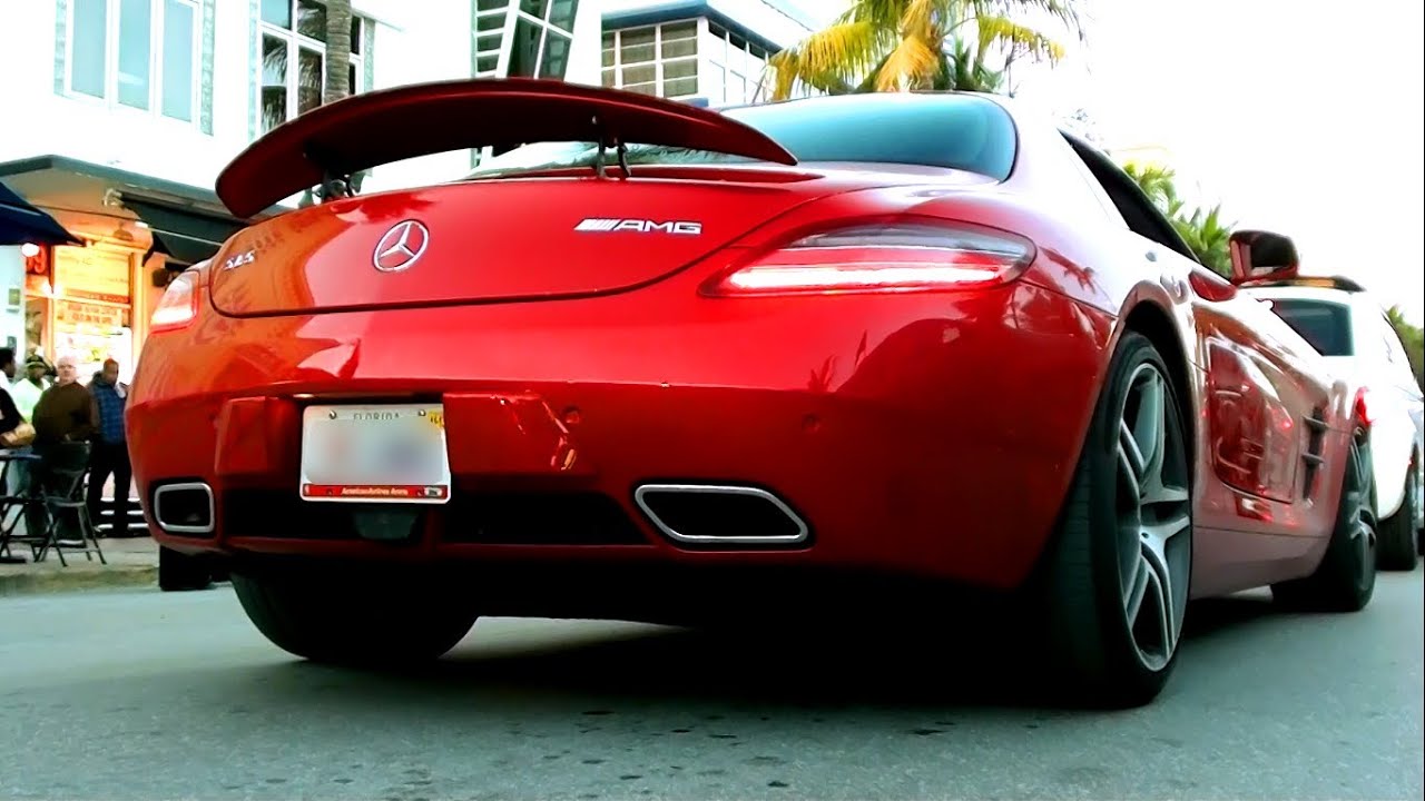 Cherry Red Mercedes Benz SLS 63 AMG driving on Ocean Drive at Miami ...