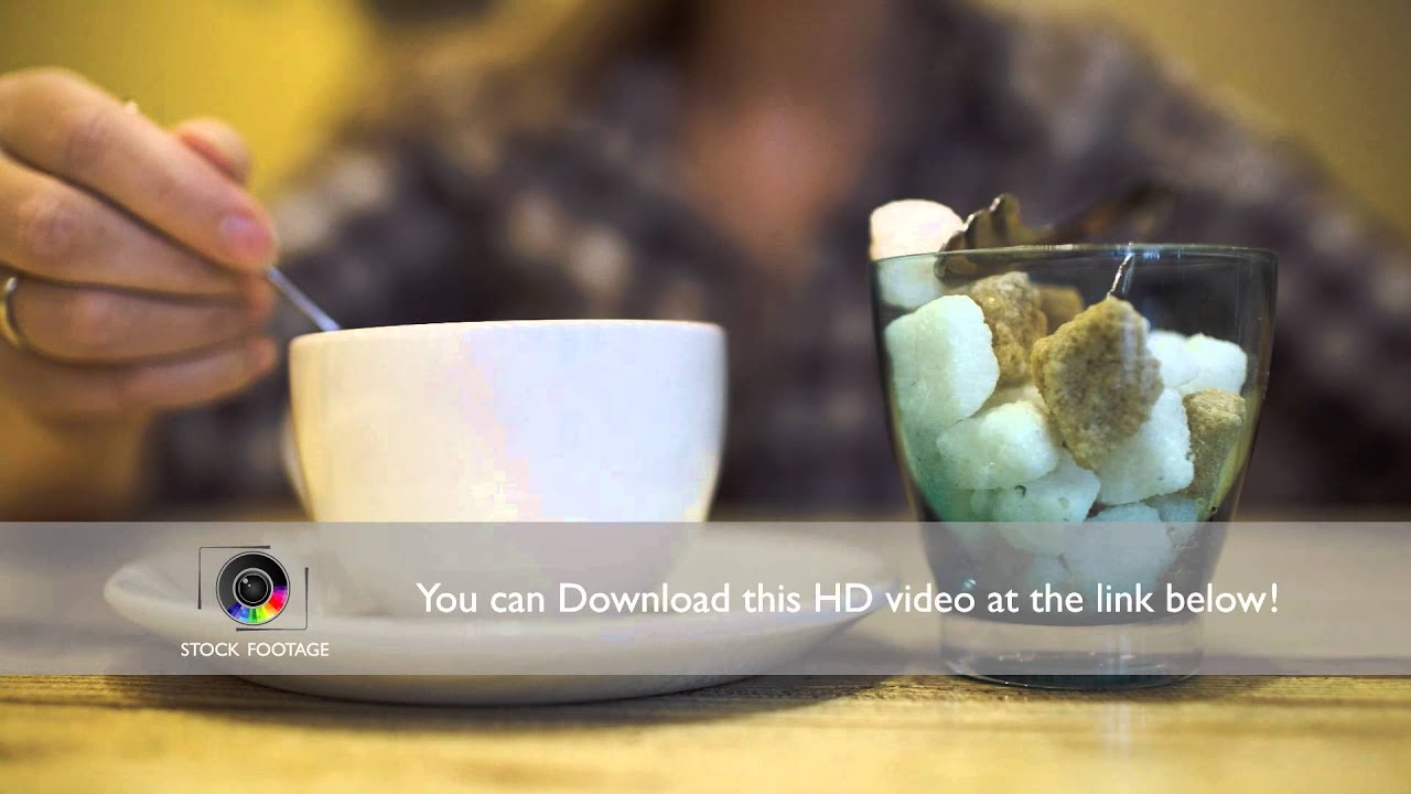 Woman putting sugar into tea cup using tongs - YouTube