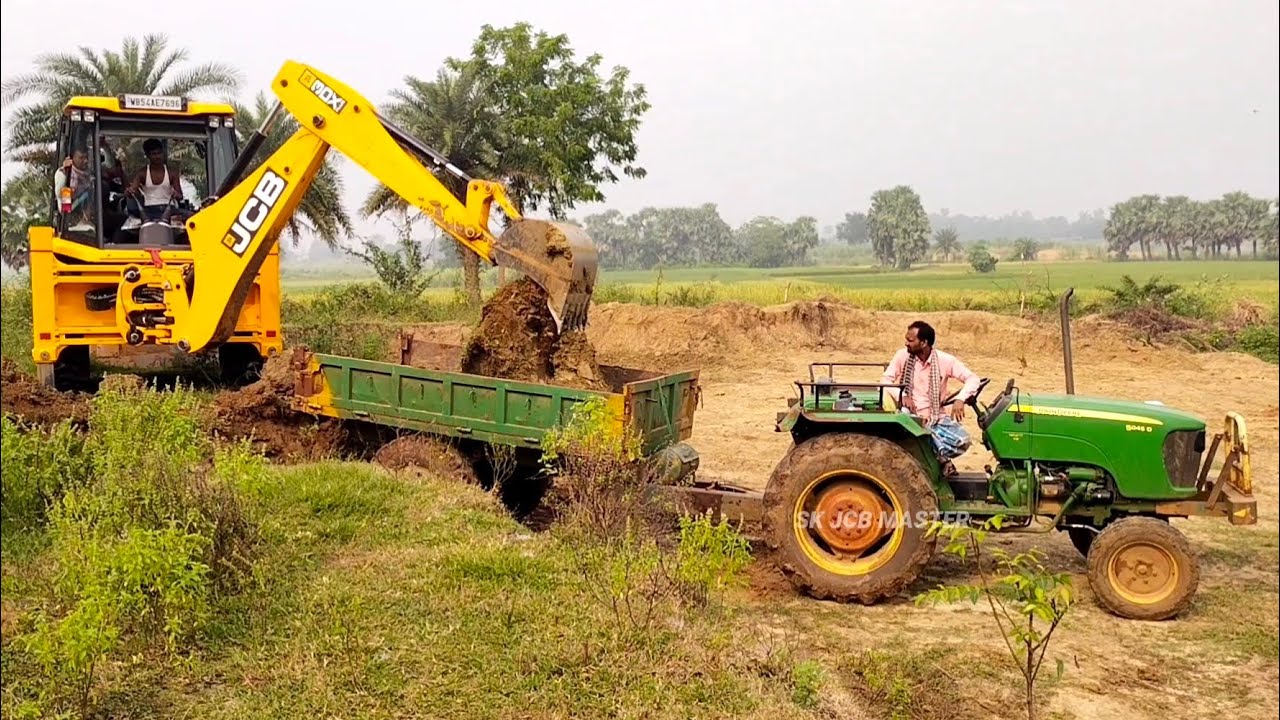 Jcb 3dx Plus Backhoe Loader Machine Loading Mud In Massey Ferguson ...