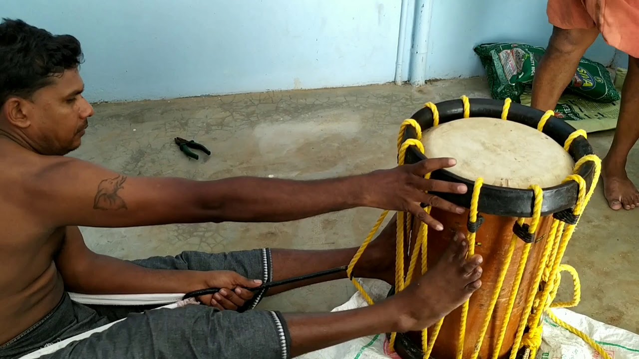 Chenda tightening in traditional method - YouTube