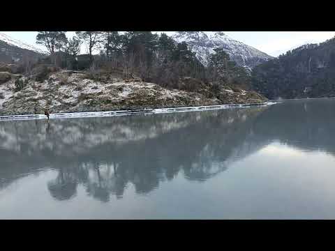 Smooth grey glass at Austefjorden 