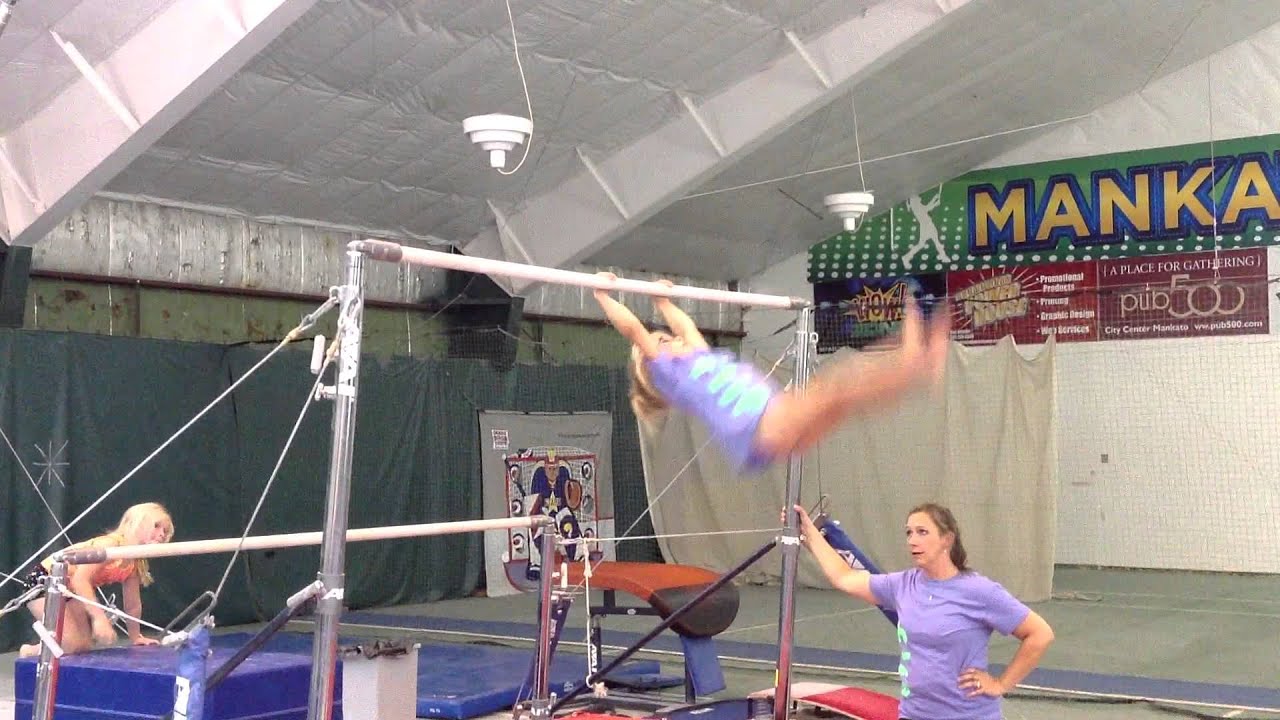 Ry on bars: jump to high bar, pull-over, baby giant - YouTube