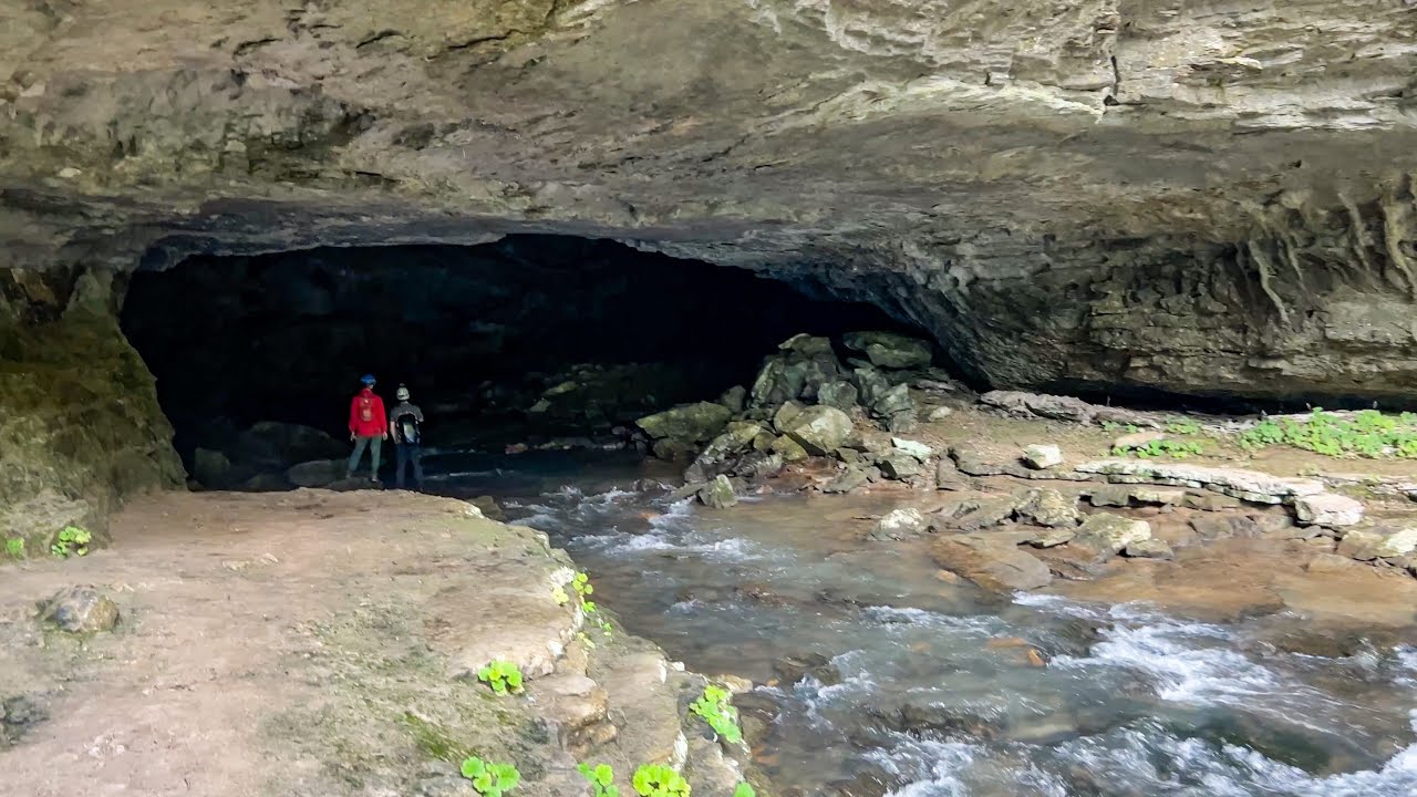 Raging River Pours Out Of Cave - YouTube