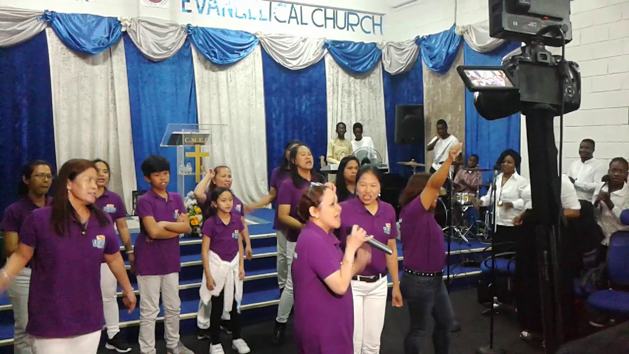 Filipino style, worship God: singing and dancing. Sing Halleluya to God ...