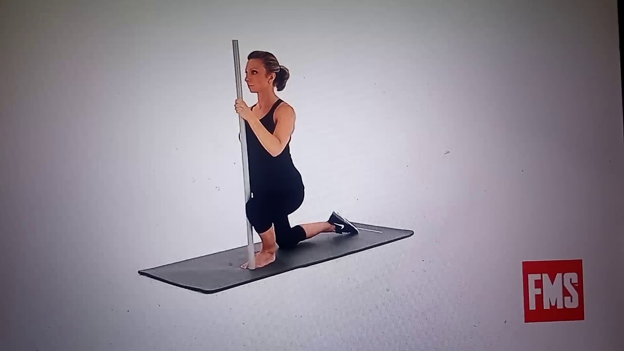 Dorsiflexion from half kneeling with dowel. - YouTube