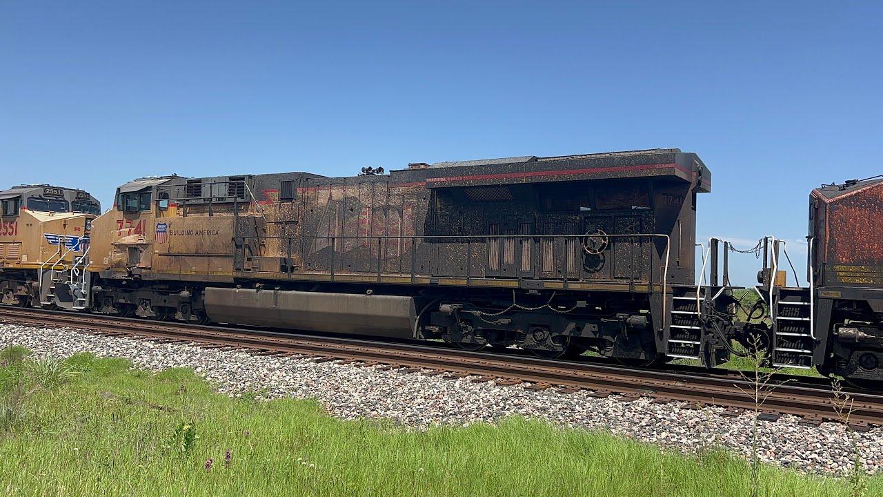 UP #2678 leads a Eastbound manifest with some wrecked locomotives dead ...