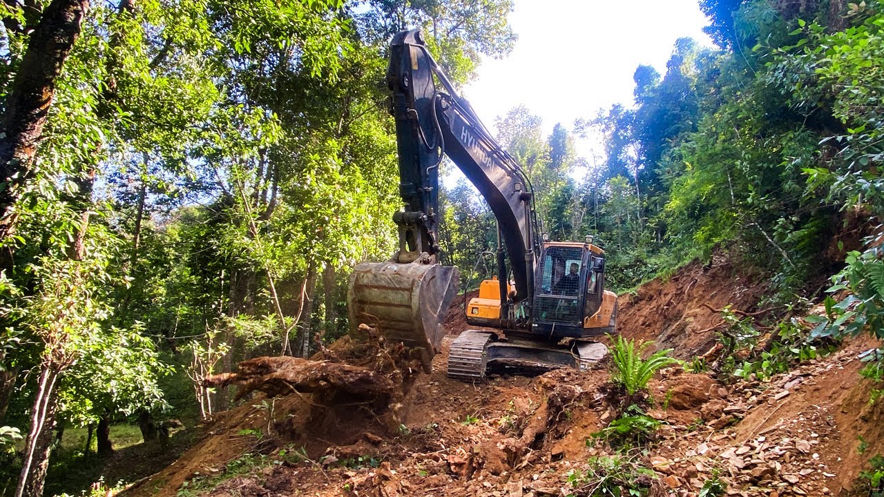 Watch an excavator build a new road in just a few hours | Excavator ...