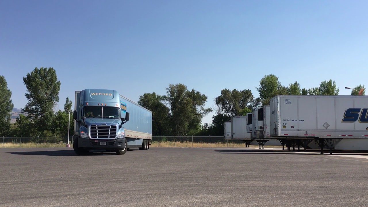 How to park a tractor-trailer in between two trailers - YouTube