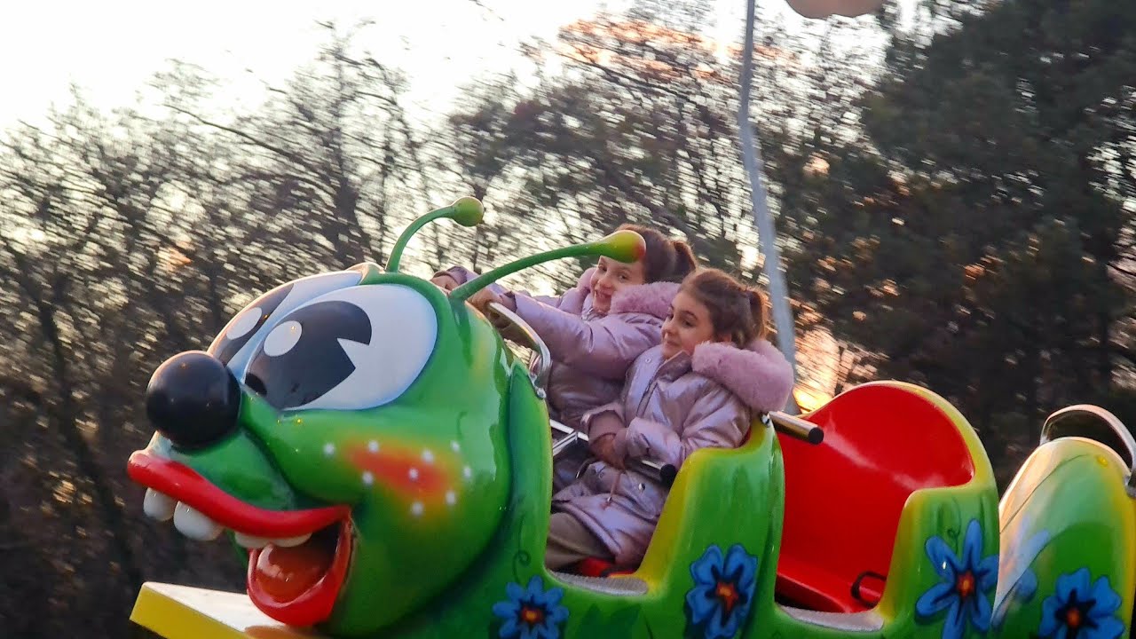 Catinca & Anastasia ride on the caterpillar roller coaster - YouTube