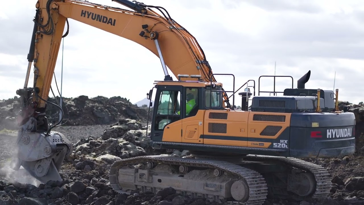 Hyundai HX520 with Xcentric Ripper Breaking up Lava Field - YouTube