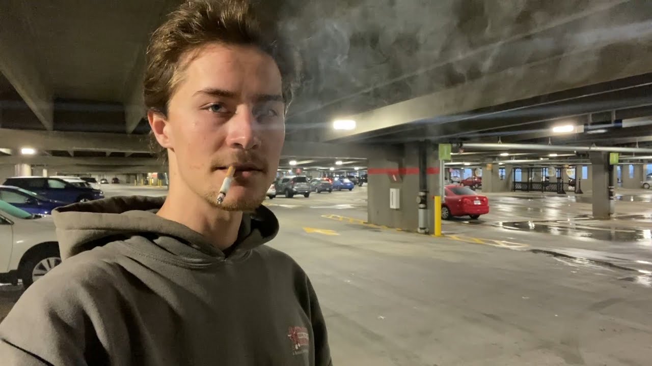 Smoking a Cigarette in a Parking Deck on a Rainy Day - YouTube