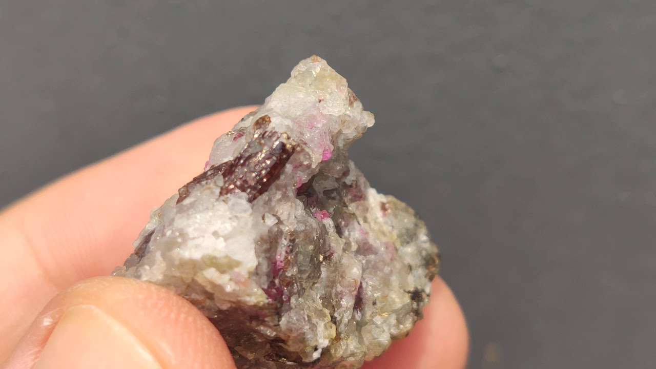 Painite crystal in matrix 1 - YouTube