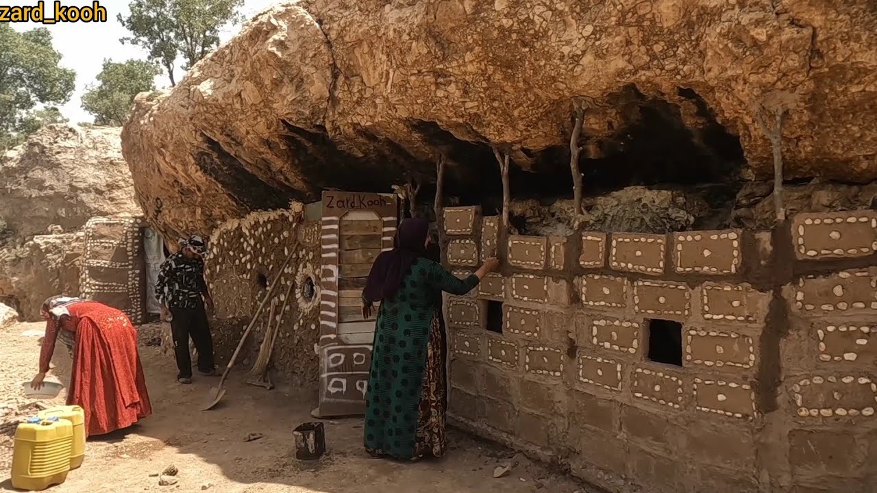 Living in a cave: Women's construction of mud brick shelter walls - YouTube