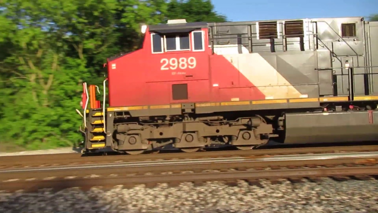 CN 2989, 2992 speeding East with mixed freight car train at Vicksburg ...