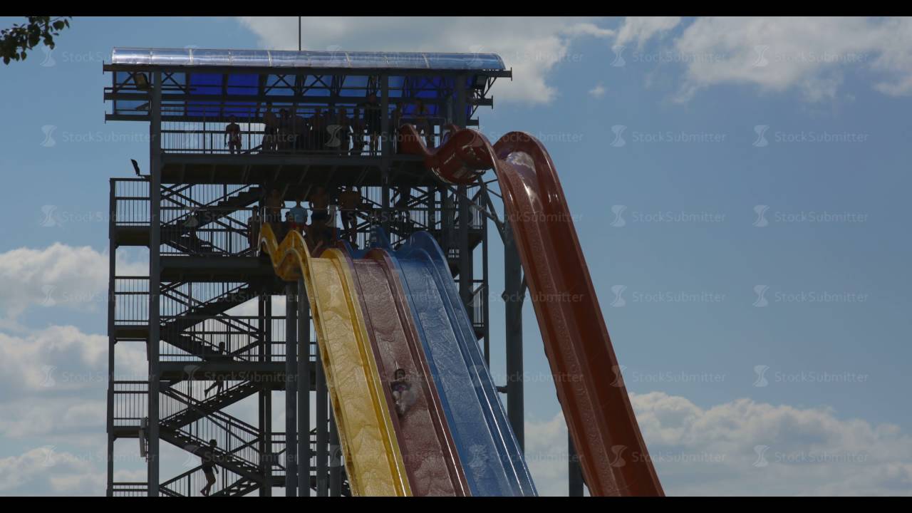 Sliding down on water slide in waterpark. Aqua park, timelapse - YouTube