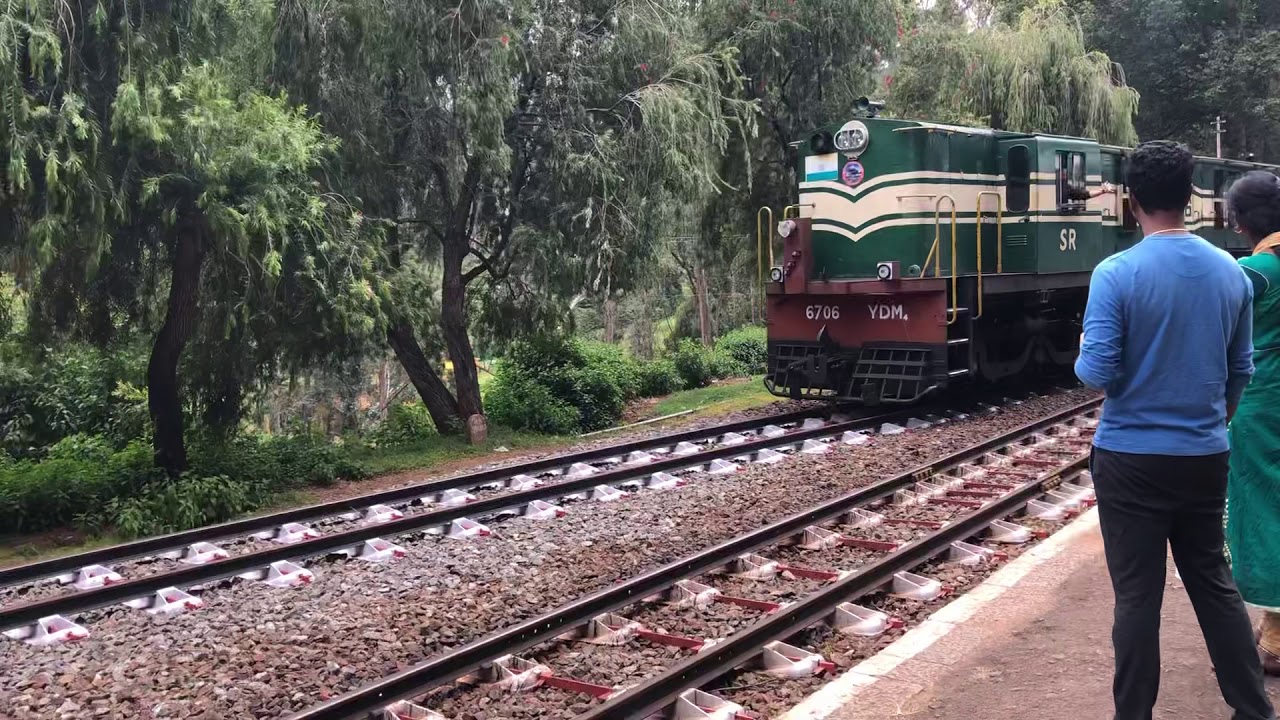 Nilgiris Blue mountain express train entering and passing through Love ...