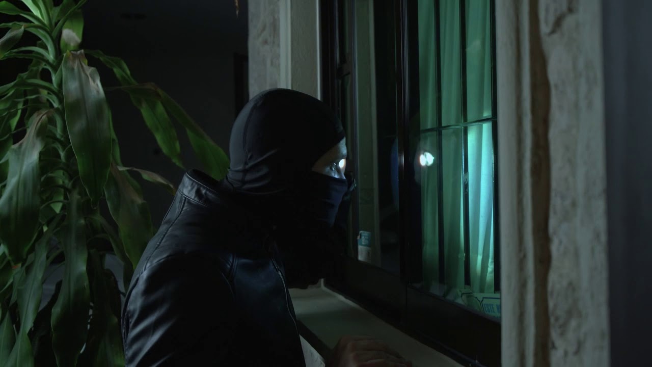 Silent thief leaning out of a house window Free Stock Video - YouTube