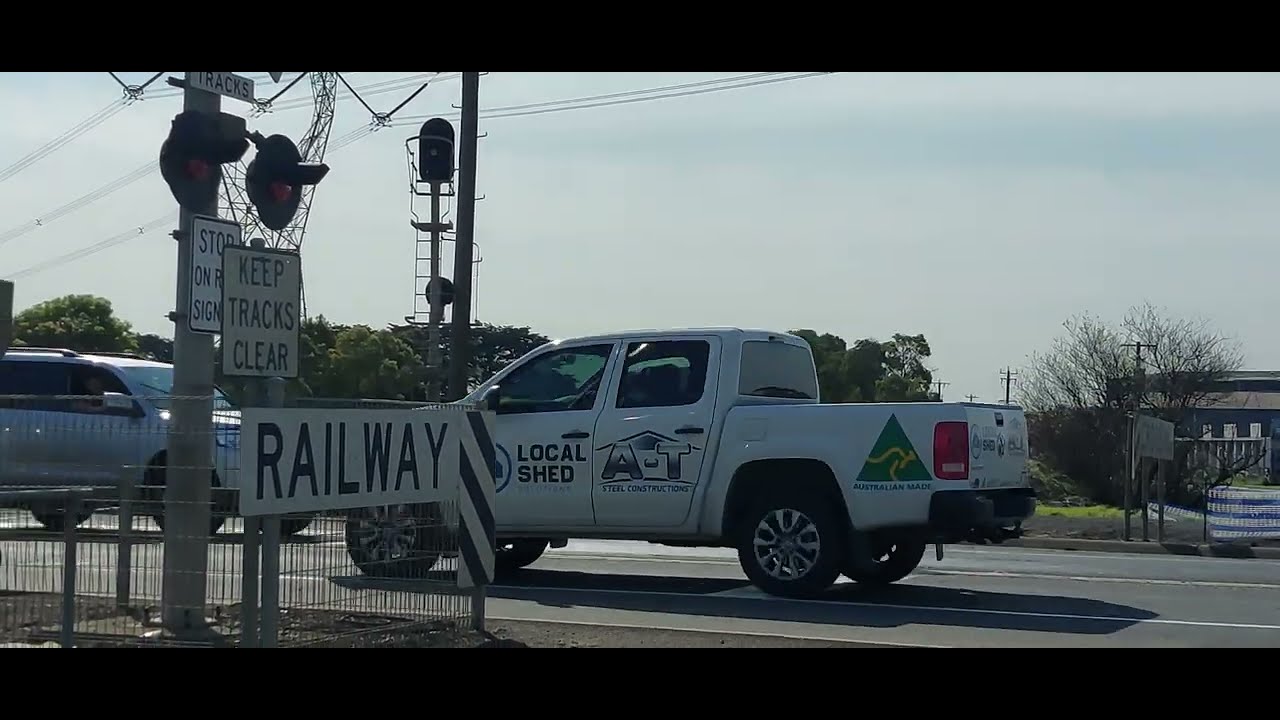 Fast train service flies by in the sun in the Latrobe Valley. Trackside ...