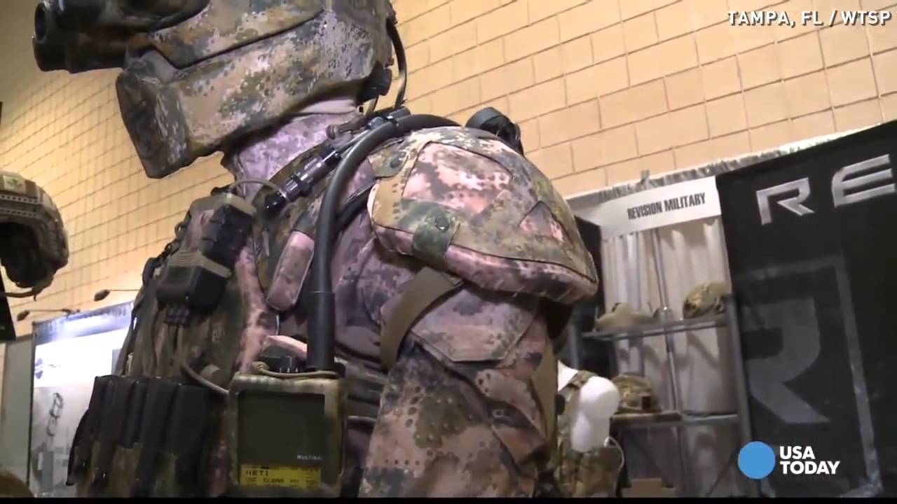 Military suit with suspended armor, computer makes debut - YouTube