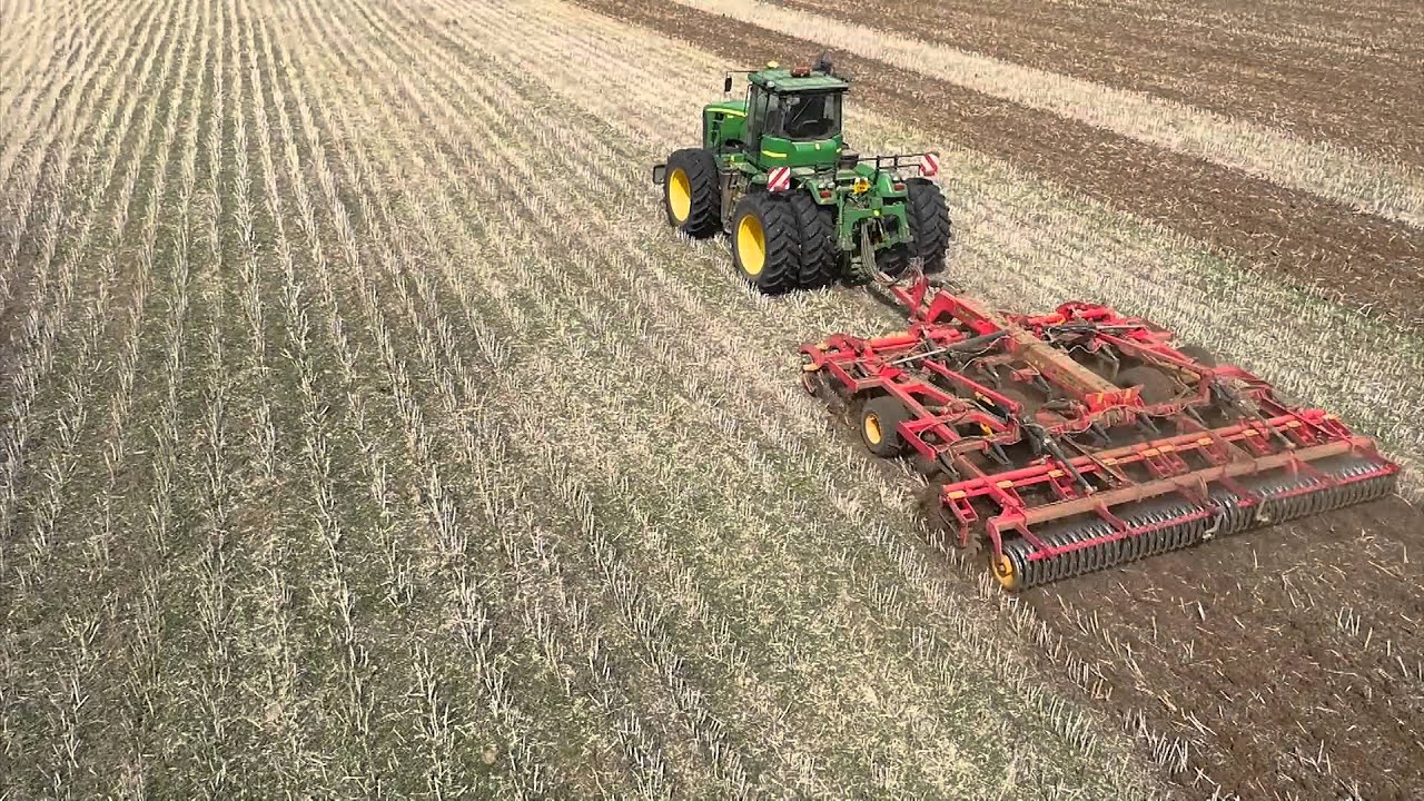 John Deere 9330 artic tractor working land with Top down cultivator in ...