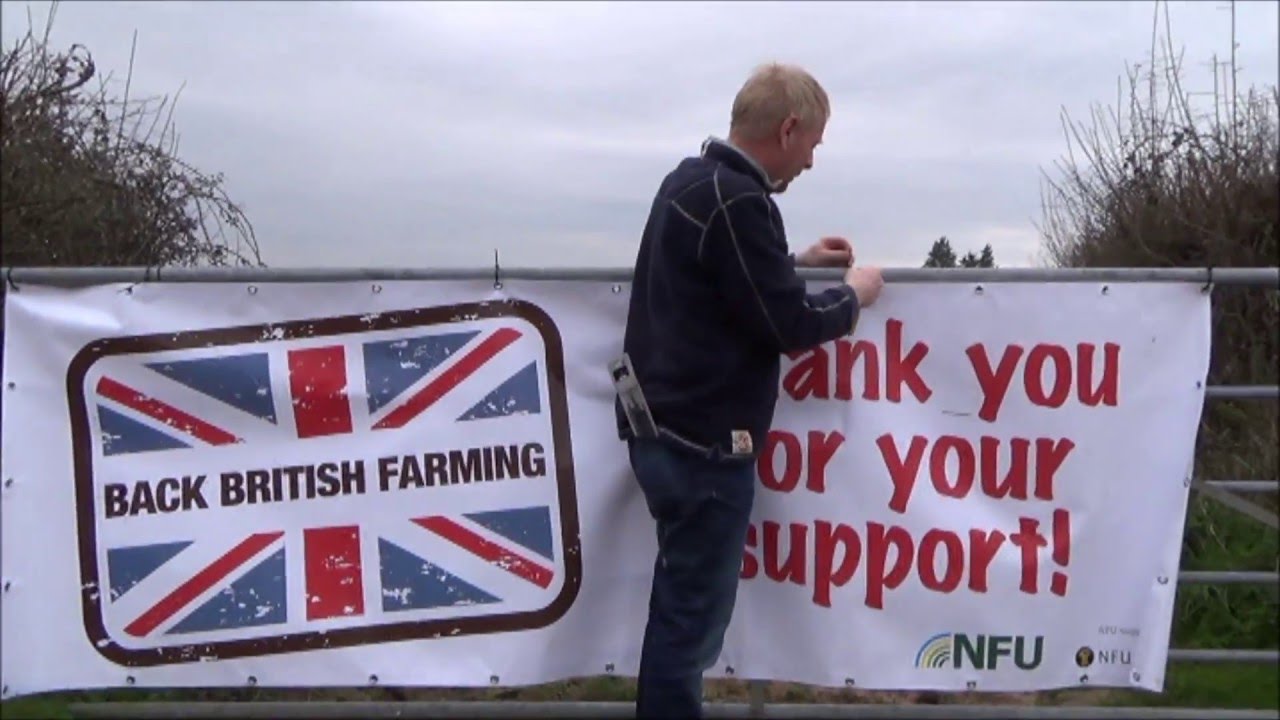 Jack and Harry put up the Back British Farming Banner - YouTube