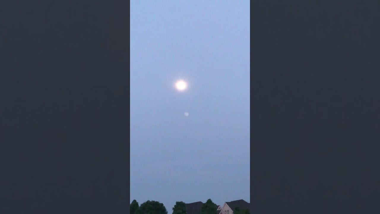 Two moons caught on camera or is it something else? - YouTube