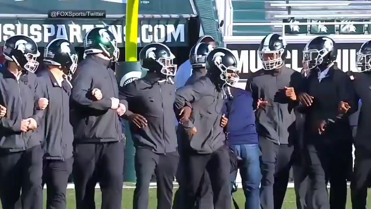 Devin Bush Destroys MSU logo and punks out whole team - YouTube