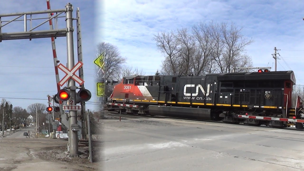 CN 3061 Intermodal passing by Ormond St. Railroad Crossing - YouTube