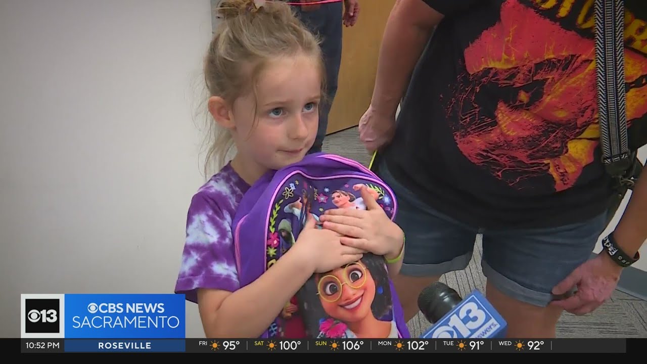 Operation Backpack: Kids pick up their packs loaded with back-to-school ...