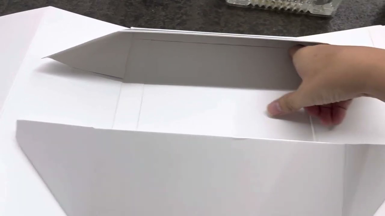 Robin explaining how Collapsible rigid box making process works - YouTube