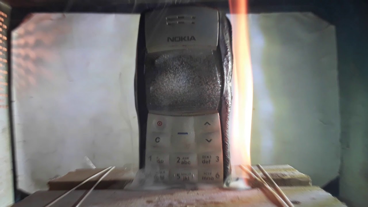 behavior of a mobile phone in a microwave - YouTube