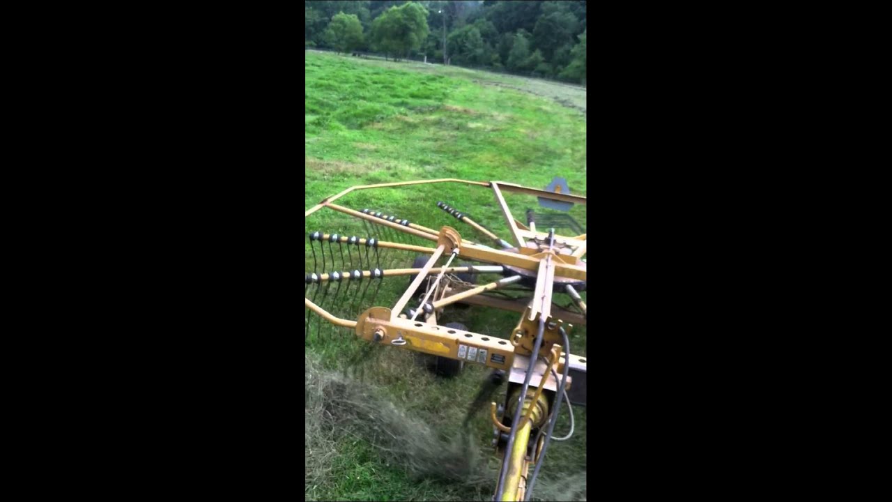 Raking windrows - YouTube