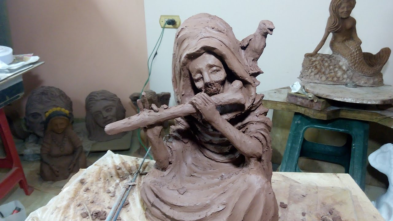 Clay sculpting. clay figure sculpting. sculpting cheerful clay ...