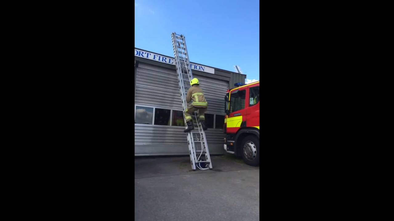 A firefighter climbs a ladder - YouTube