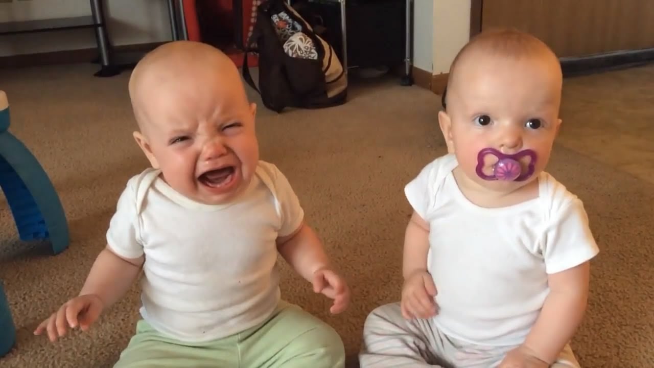 Twin baby girls fight over pacifier - YouTube