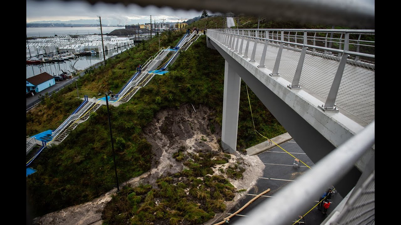 Heavy rains lead to mudslide under new Wilson Way bridge - YouTube
