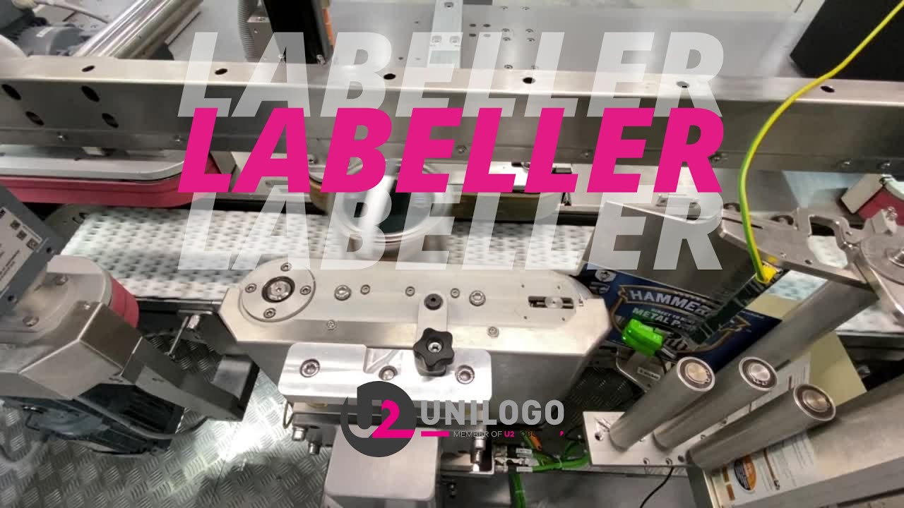 Flexible labelling machine for paint cans - YouTube