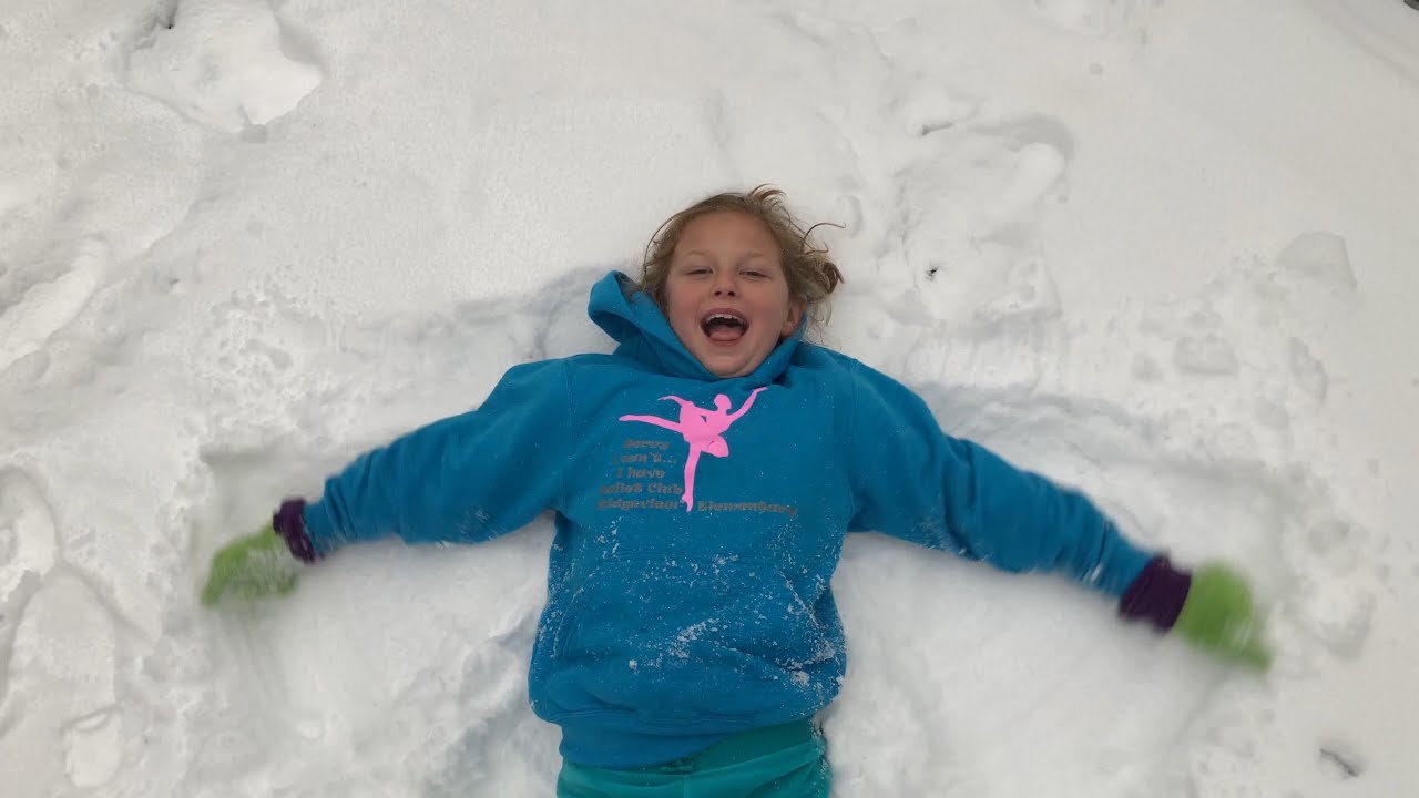 Snow Angel Plays In The Snow - YouTube