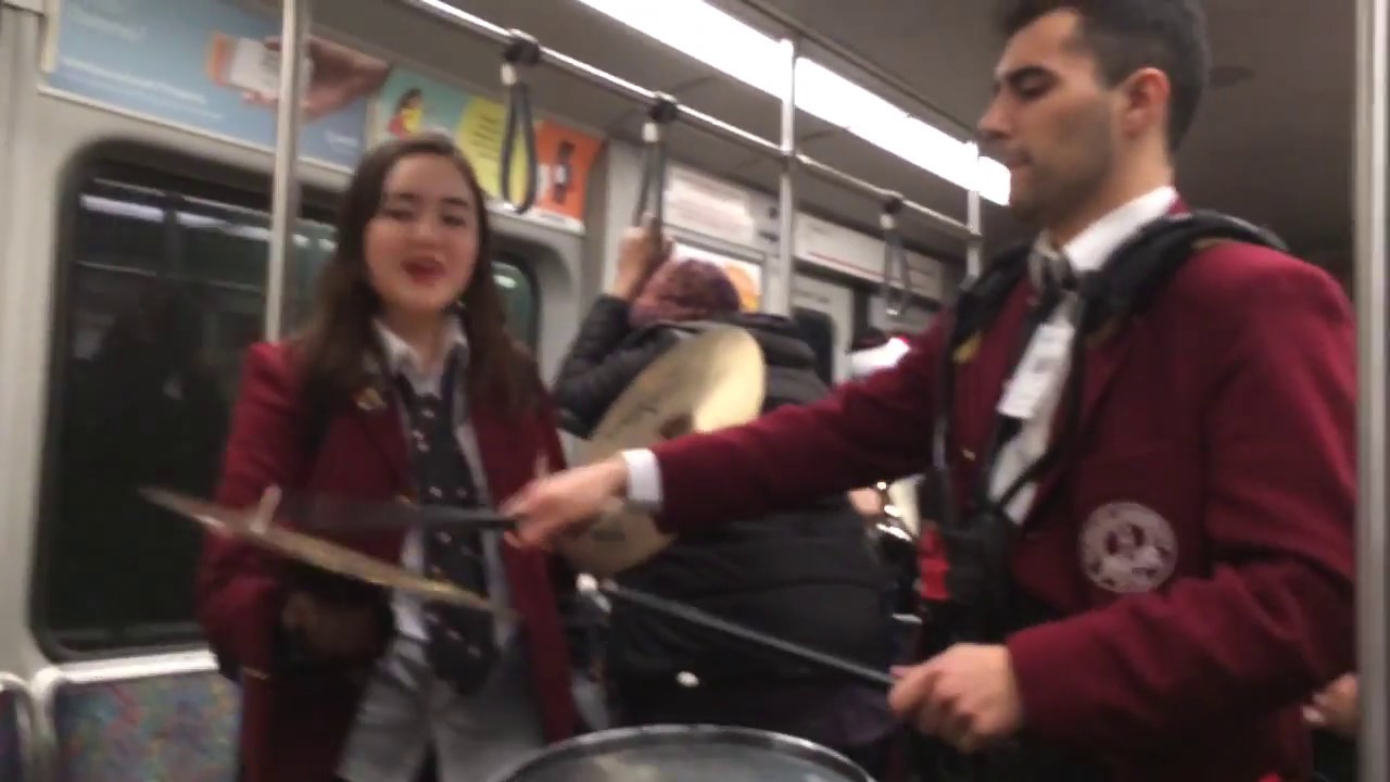 Harvard Crimson Marching Band plays on the subway - YouTube